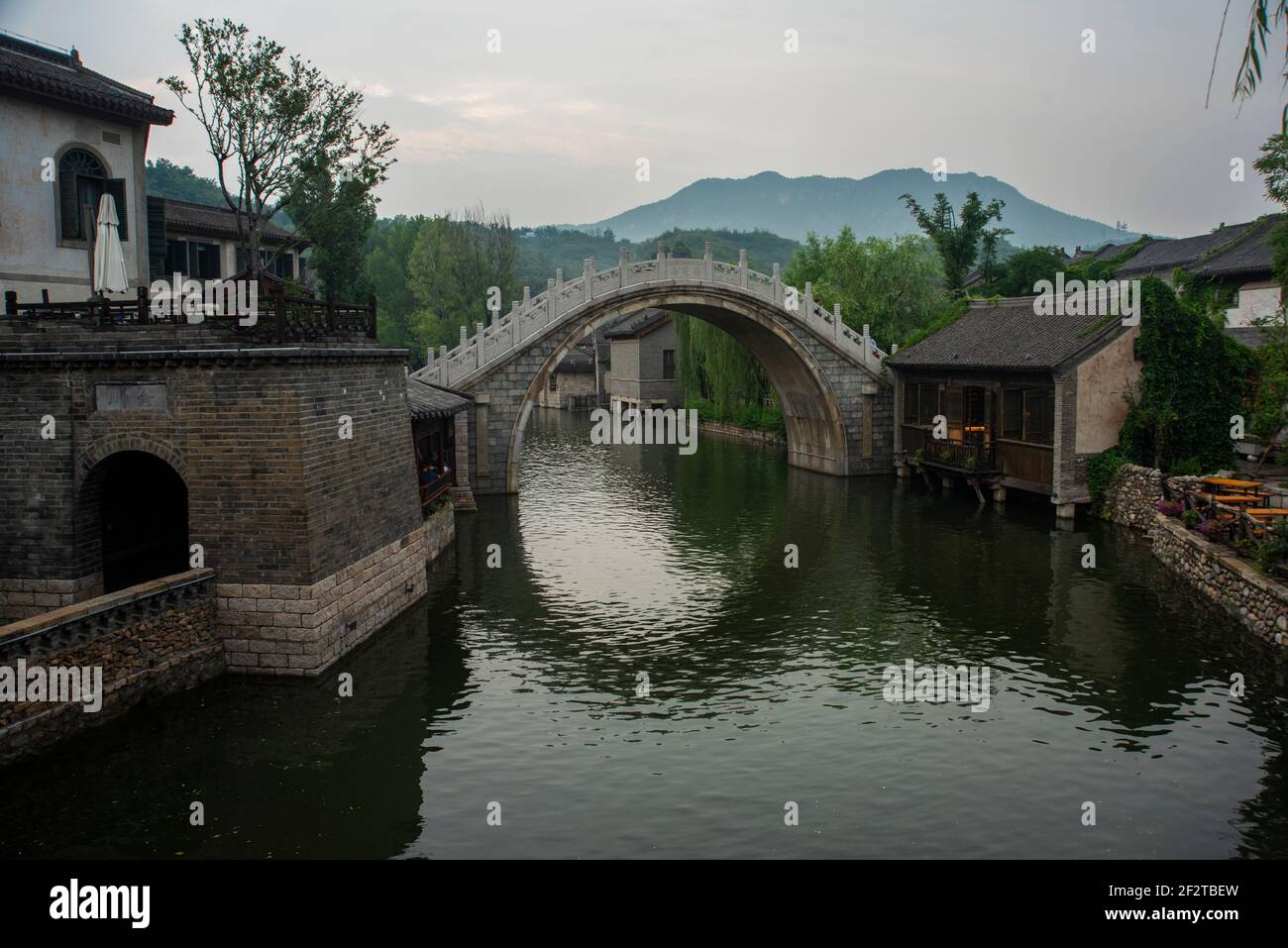 Historical small bridge over the river in a village Stock Photo - Alamy