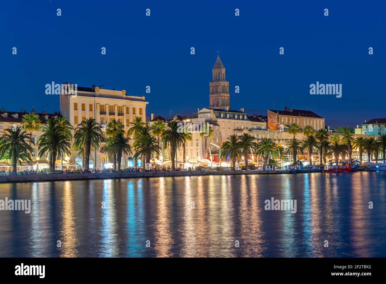 Night view of cityscape of Croatian city Split behind Riva promenade ...