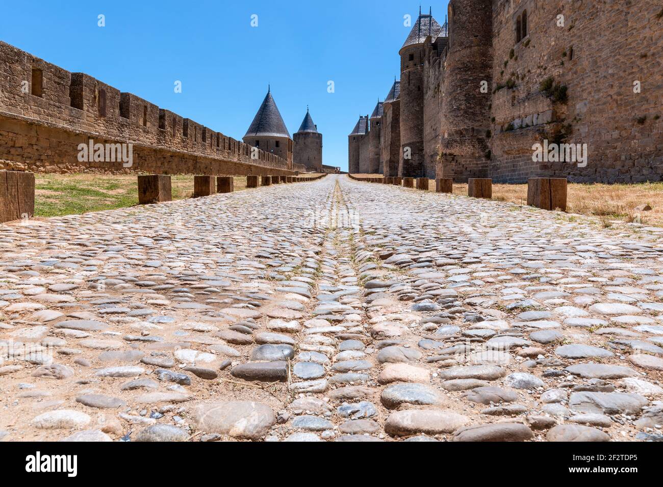 Ancient paved stone road in the medieval castle of Carcassonne town ...