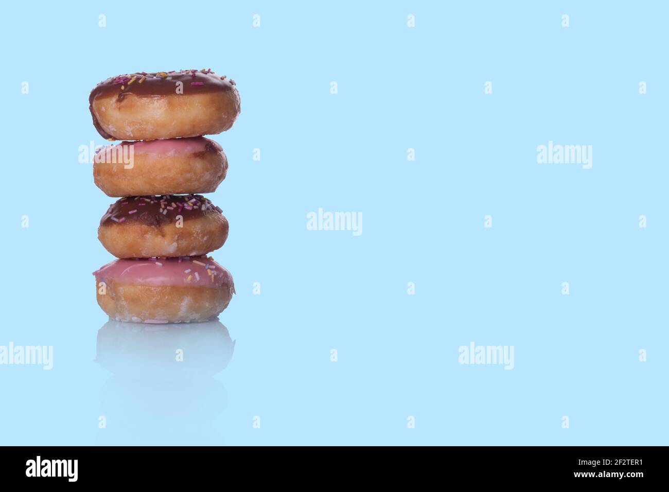 banner of four doughnuts on blue background Stock Photo - Alamy