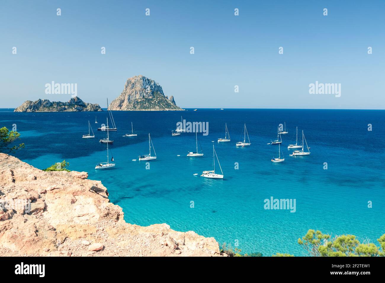 Turquoise sea with sea yachts off the coast of the island Es Vedra ...