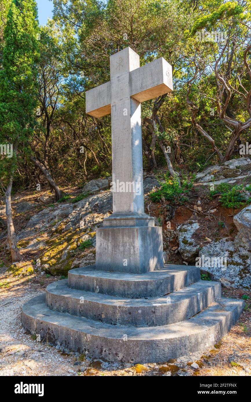 The cross of Triton at Lokrum island in Croatia Stock Photo - Alamy