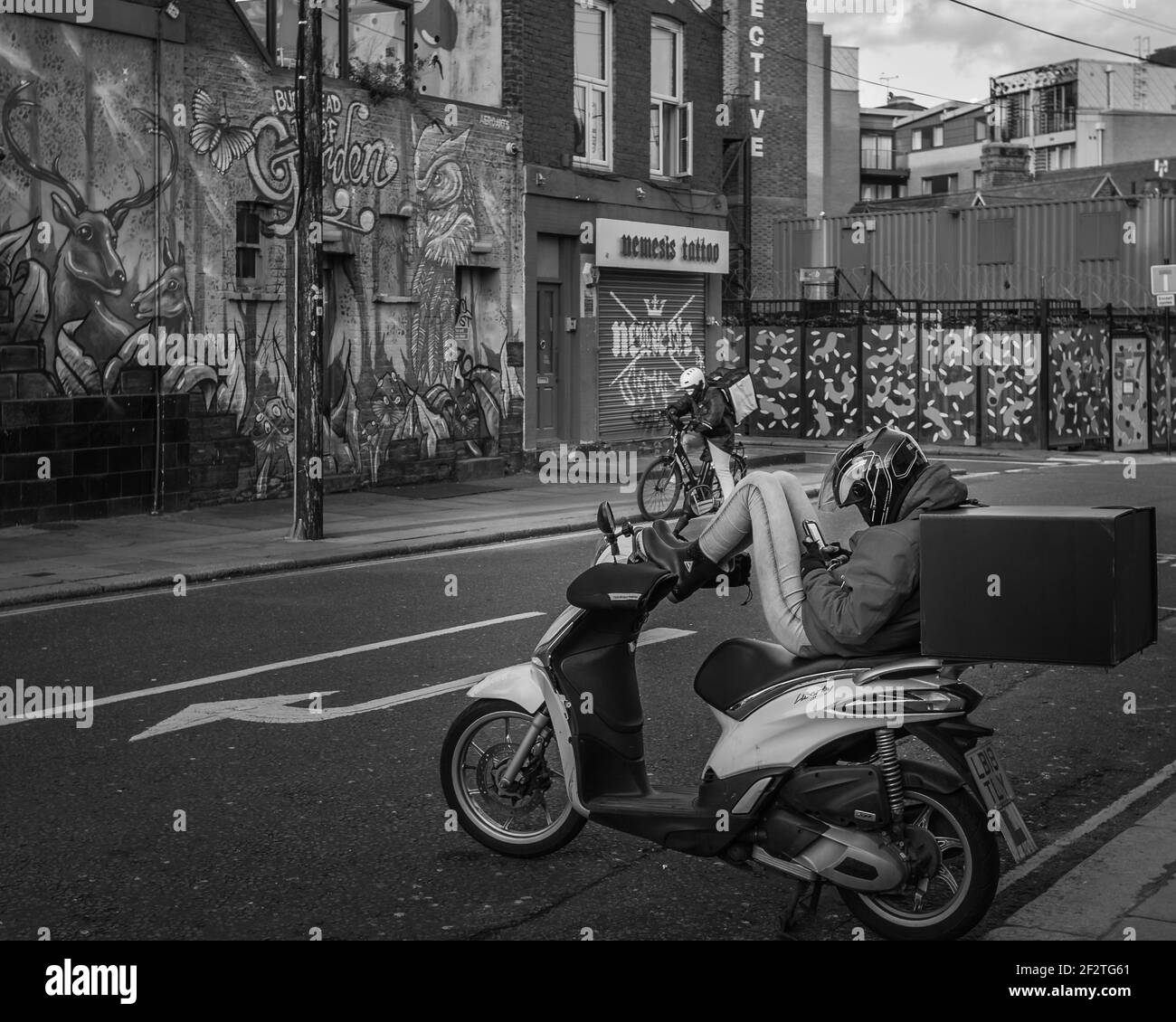 Deliveroo food courier delivery Black and White Stock Photos & Images ...