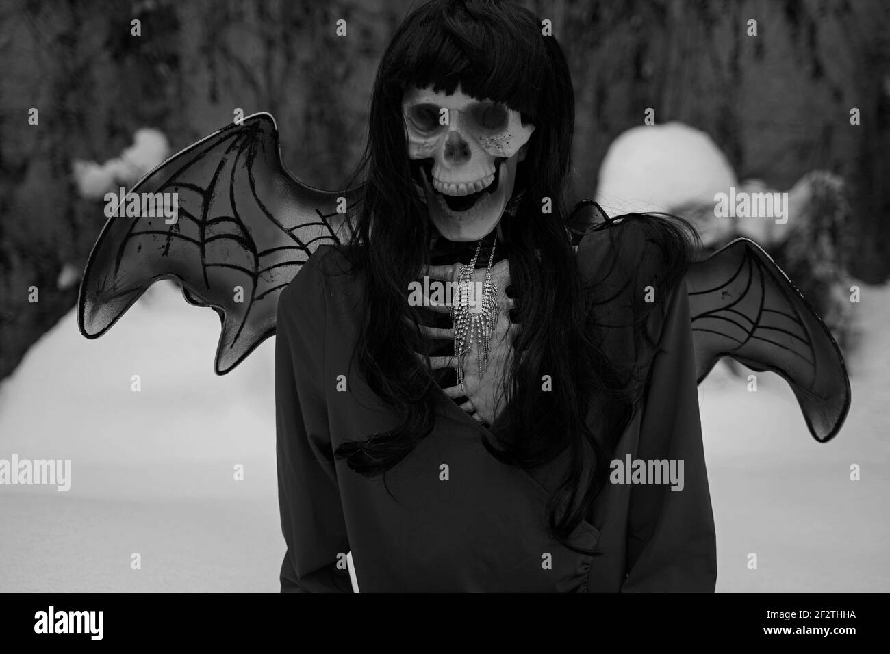 Devil bride skeleton with red dress and devil wings in snow Stock Photo ...