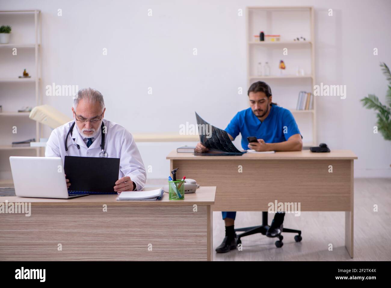 Two doctors working in the hospital Stock Photo - Alamy