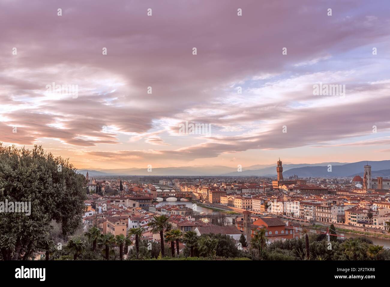 Stunning sunset over Florence and its famous landmarks. Palazzo Vecchio ...