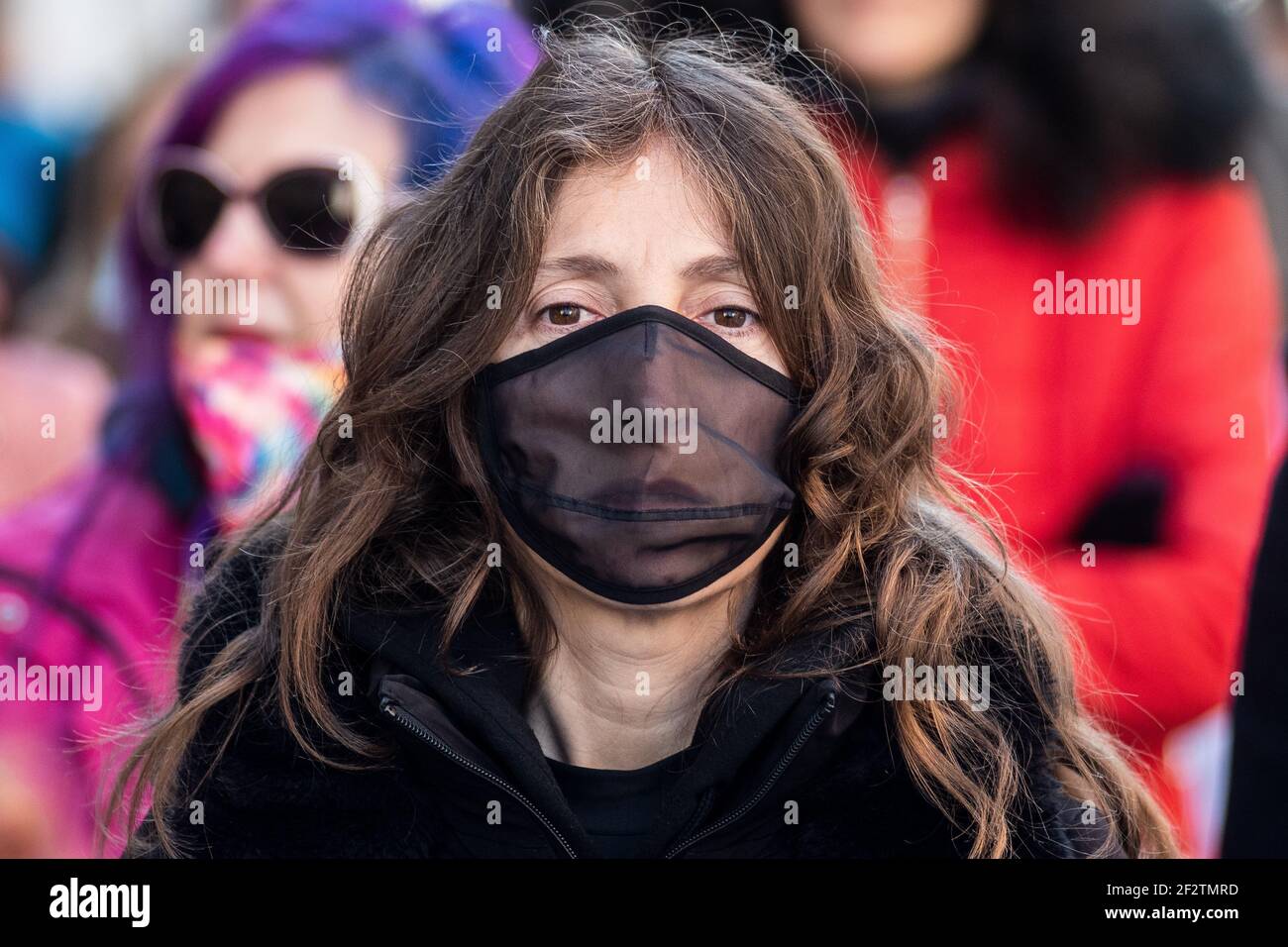 Madrid, Spain. 13th Mar, 2021. A woman wearing a transparent face mask ...