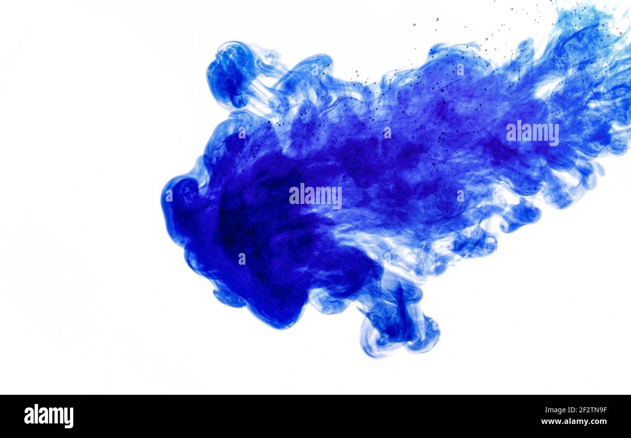 Blue ink injected into water from syringe, colour mixing with water ...