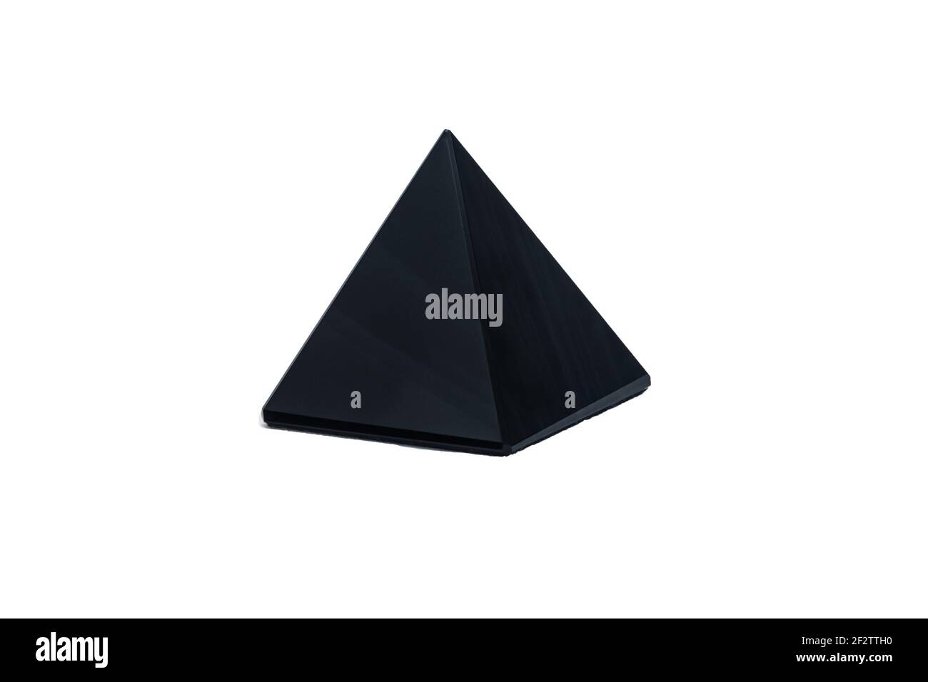 Black pyramid made of obsidian stone. Isolated on white background ...