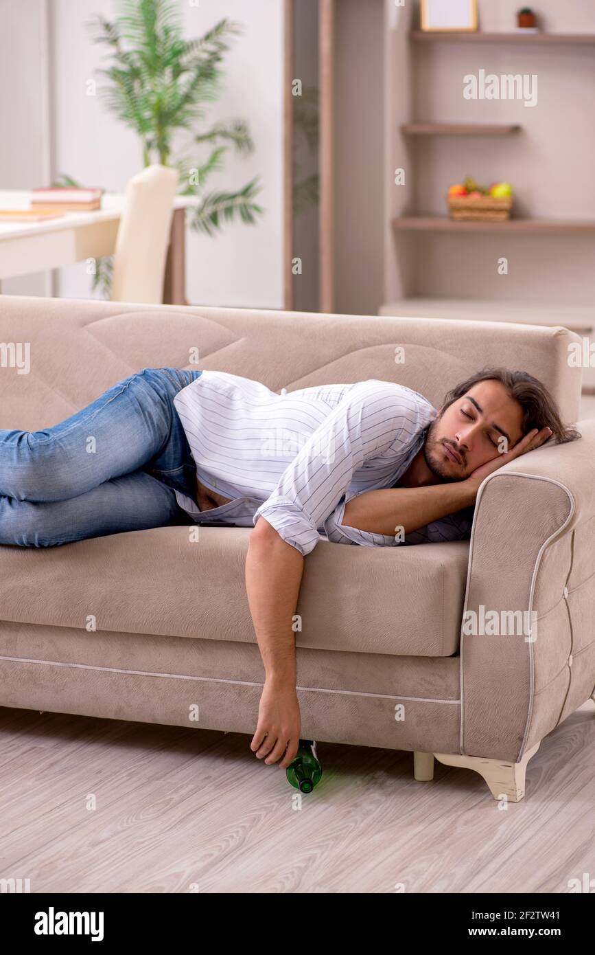 Man drinking alcohol at home Stock Photo - Alamy