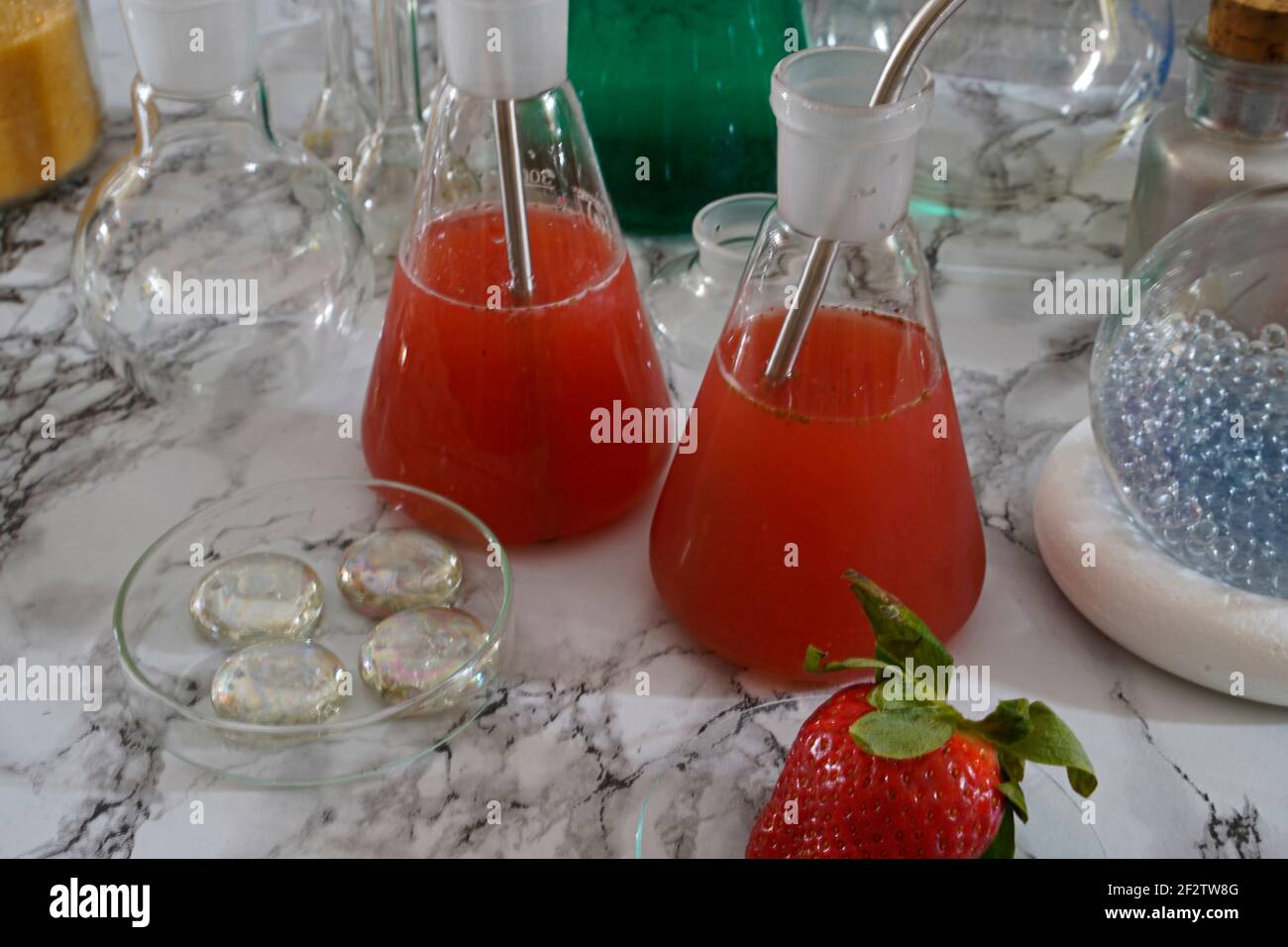strawberry tonic laboratory cocktail in flask. tasty cocktails made and ...
