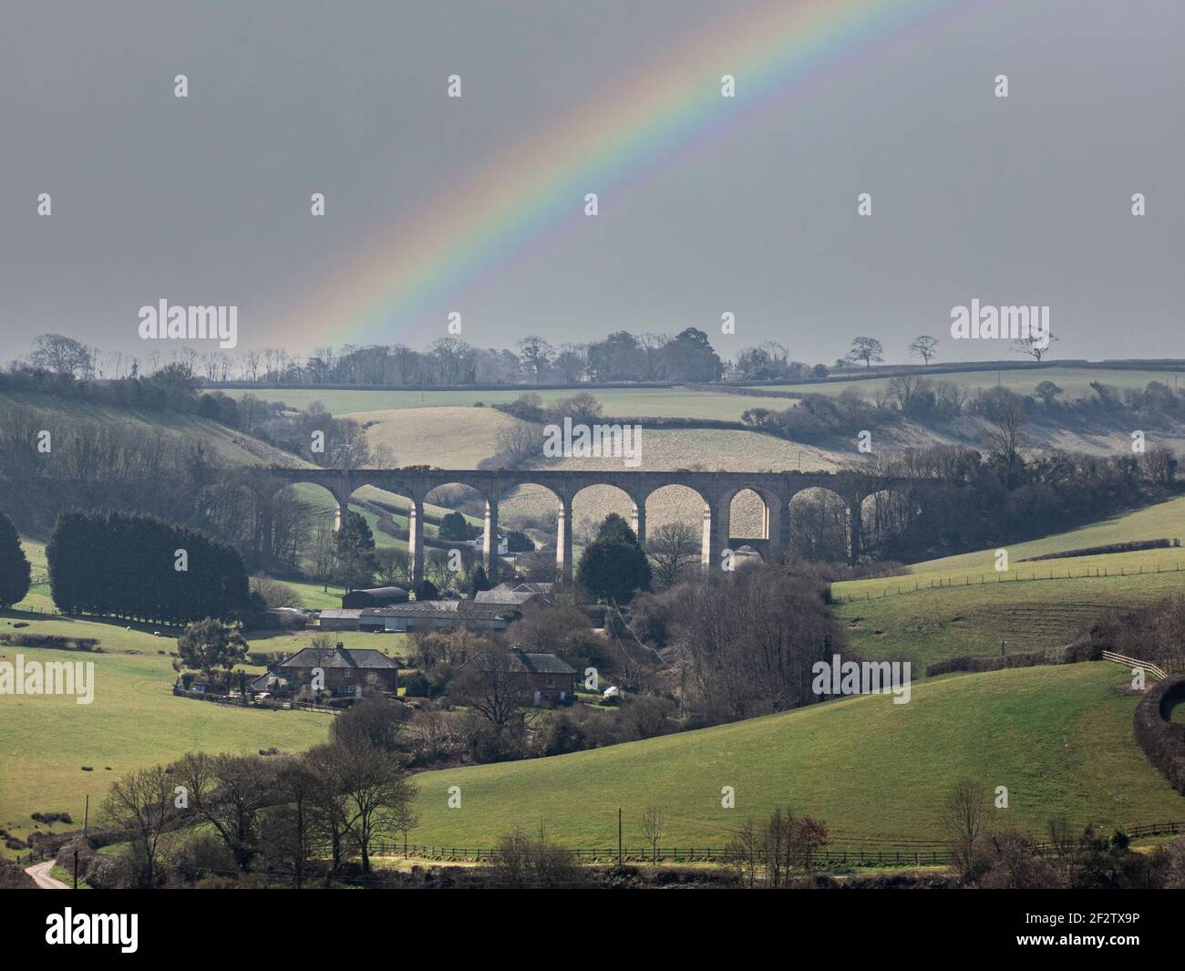 A rainbow over the Cannington Viaduct on the disused Axminster & Lyme Regis Light Railway, near ...