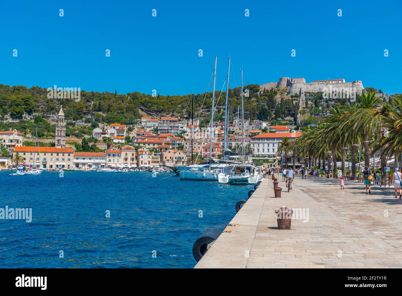 People are strolling at waterfront of Hvar town in Croatia Stock Photo ...