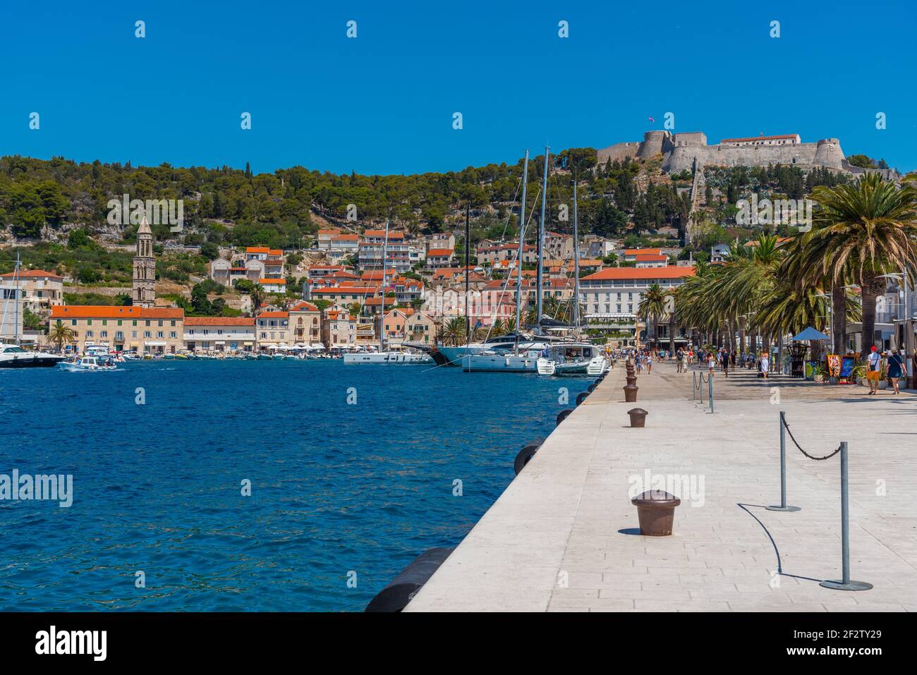 People are strolling at waterfront of Hvar town in Croatia Stock Photo ...