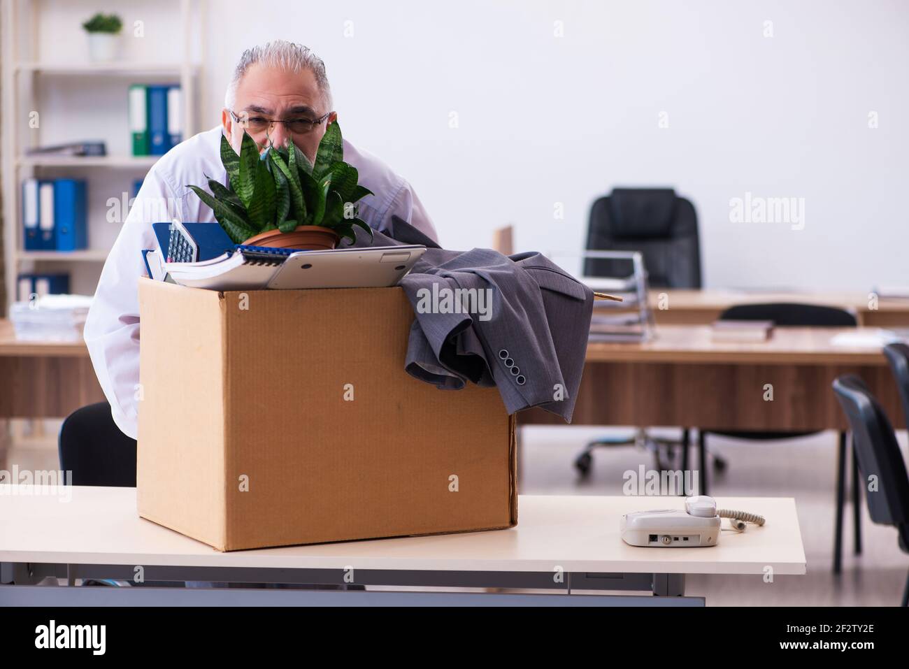 Old employee being fired from his work Stock Photo - Alamy