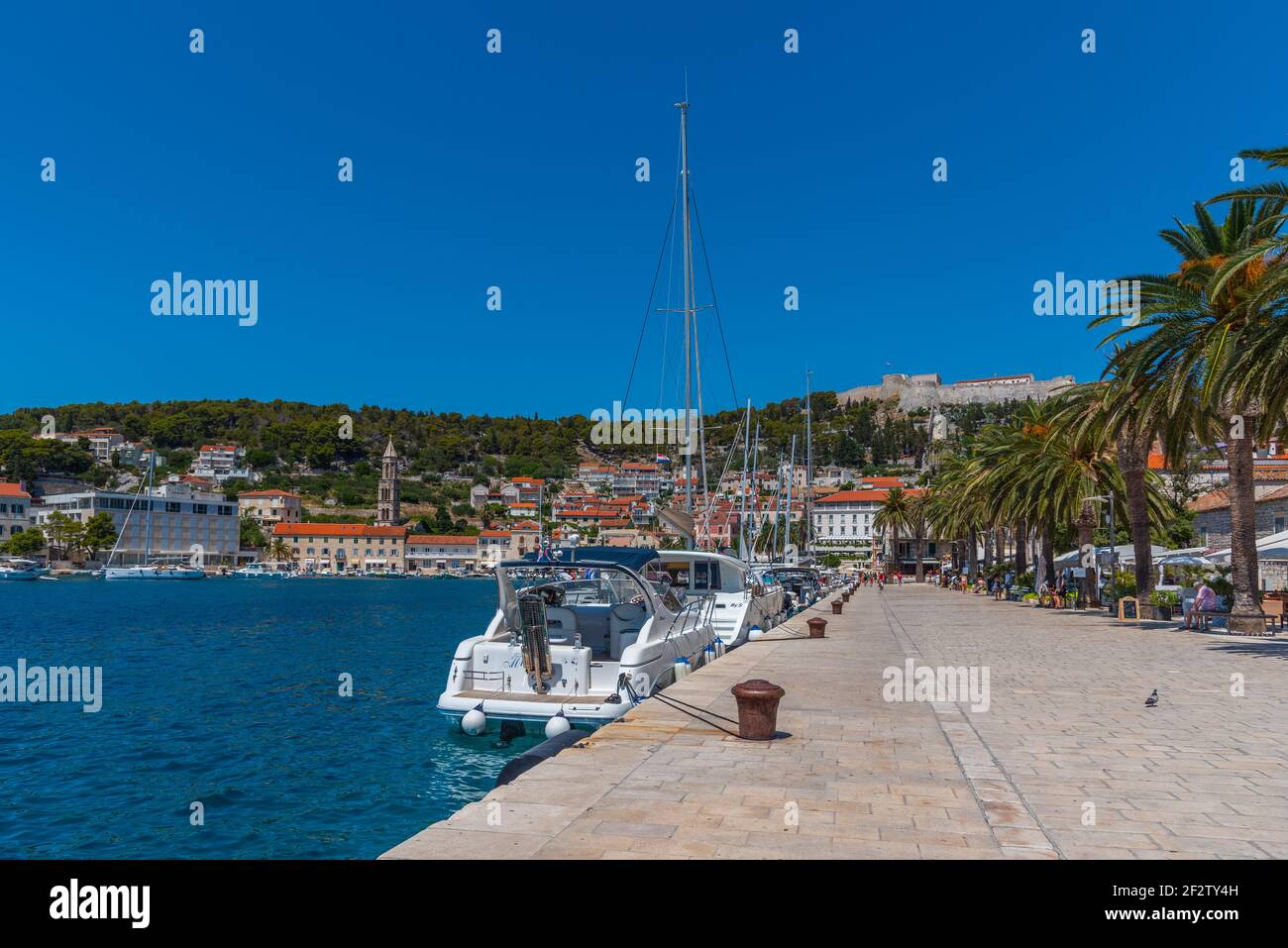 People are strolling at waterfront of Hvar town in Croatia Stock Photo ...