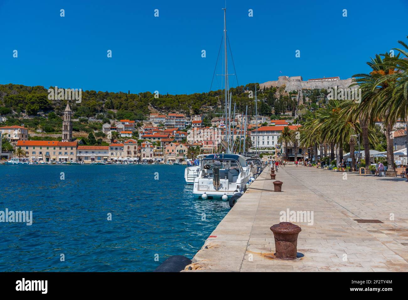 People are strolling at waterfront of Hvar town in Croatia Stock Photo ...