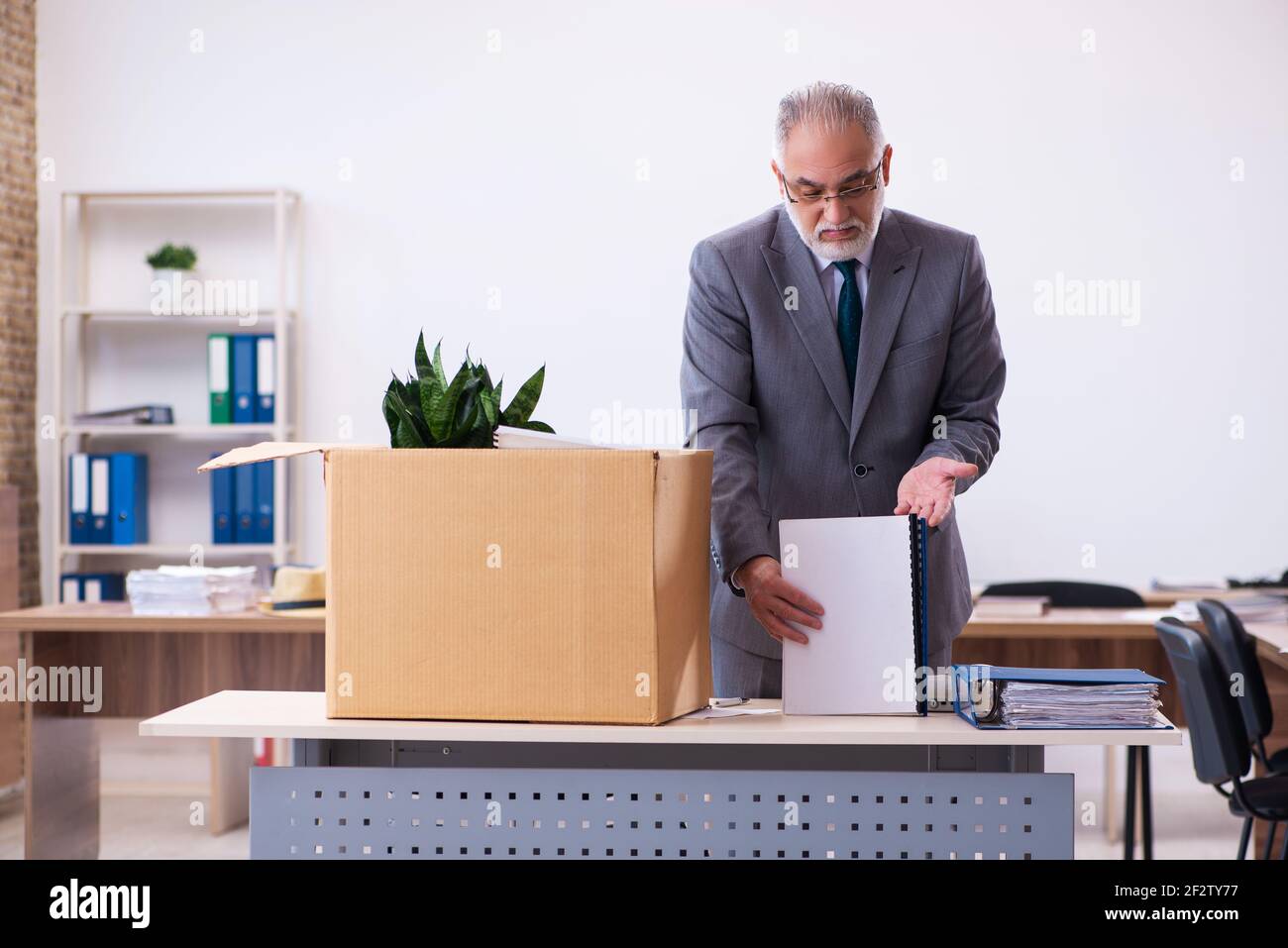 Old employee being fired from his work Stock Photo - Alamy