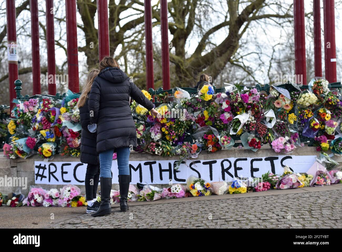 Clapham Common, London, UK. 13th Mar 2021. People paying their respects ...