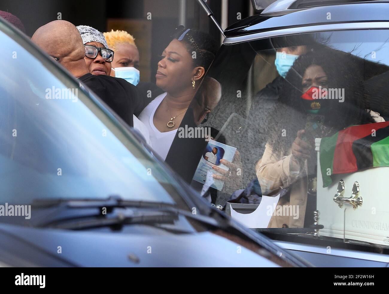 Mourners follow the coffin of George Nkencho, who was shot dead by ...