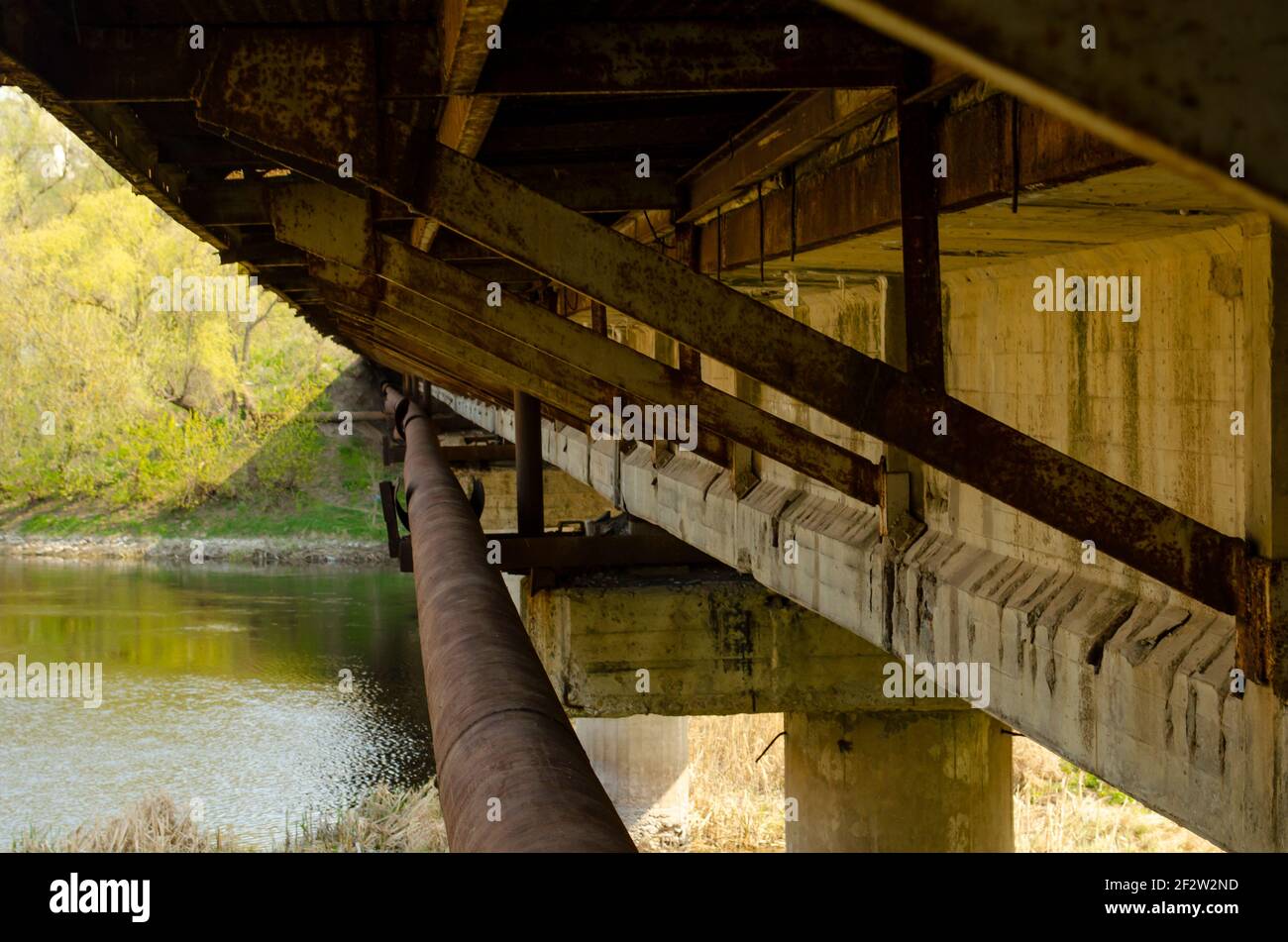 Reinforced concrete bridge dilapidated pillars. Overpass seen from ...