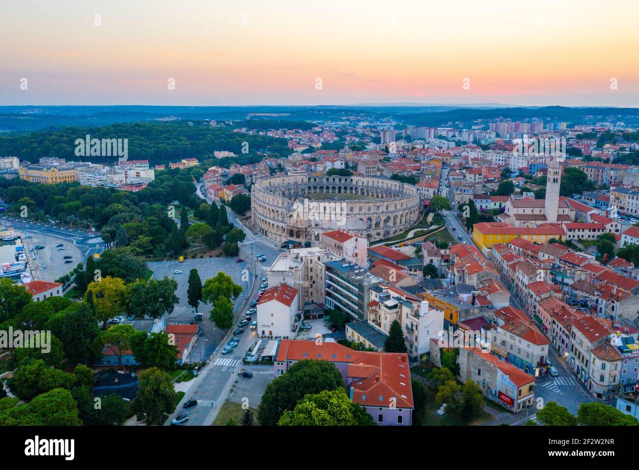 Sunrise view of cityscape of Pula with Roman amphitheatre and Saint ...