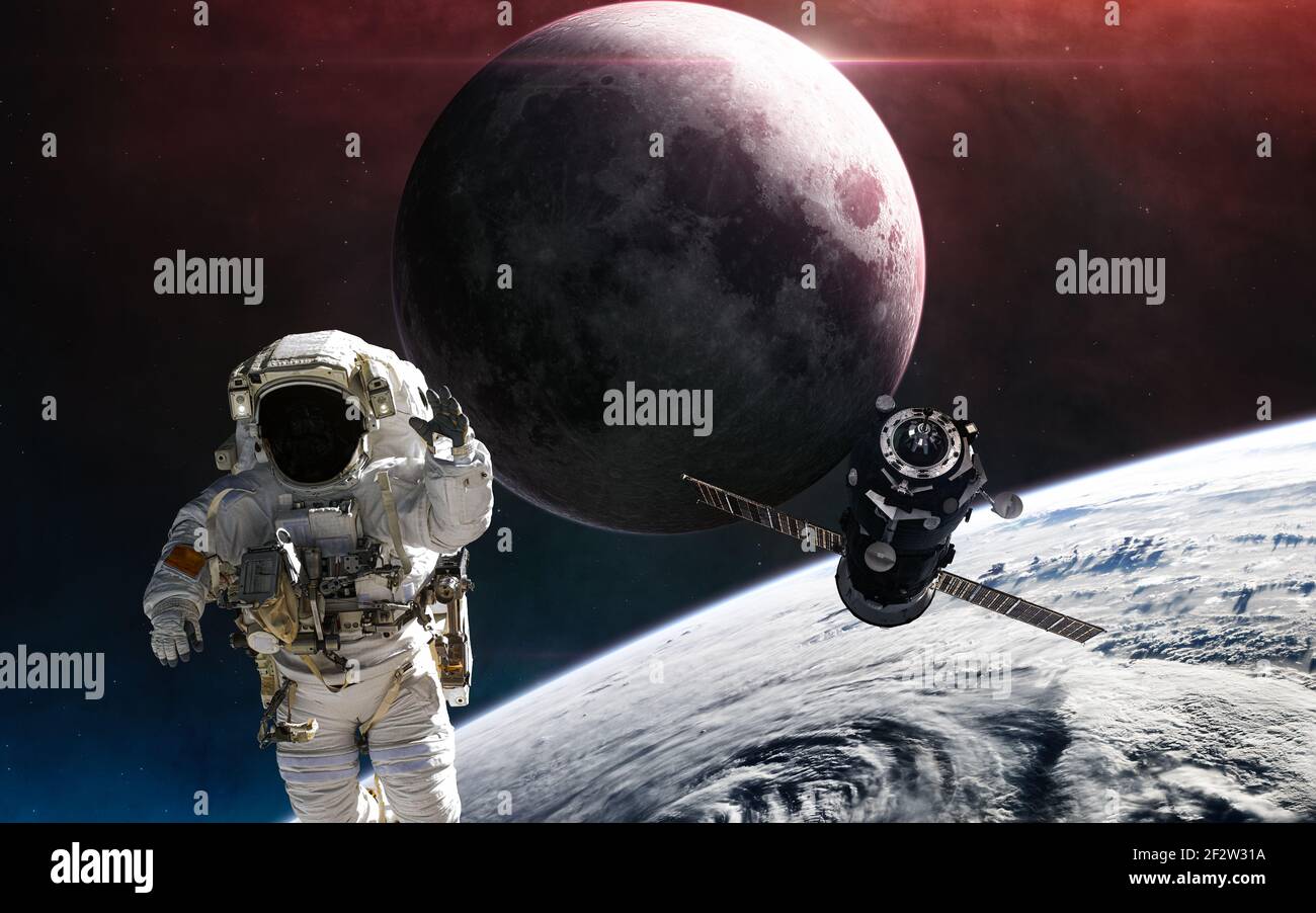 Astronaut and space station orbiting Earth. Moon. Solar system Stock ...