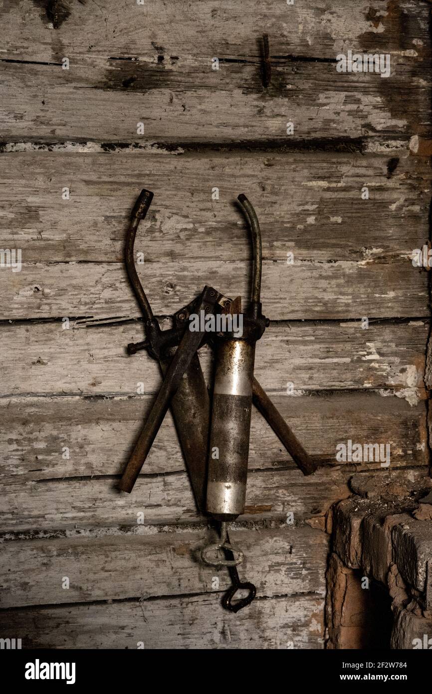 scrap metal parts and old rusty tools in abandoned workshop ancient ...