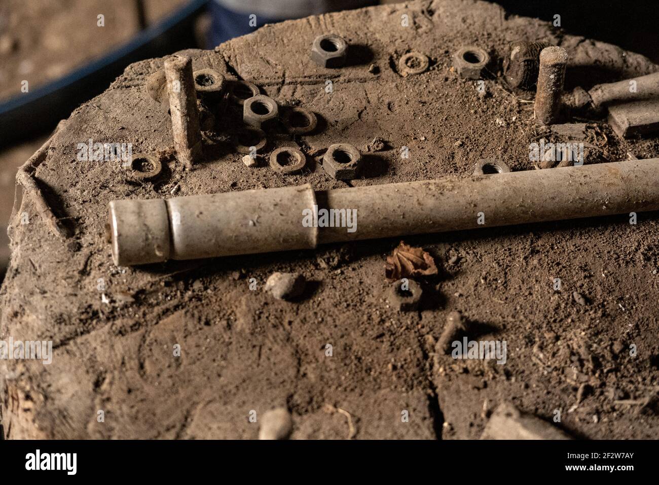 scrap metal parts and old rusty tools in abandoned workshop ancient ...