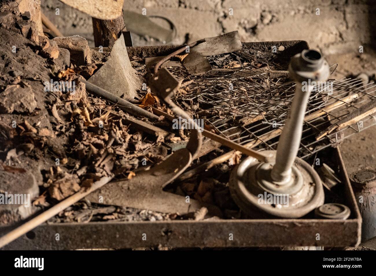 scrap metal parts and old rusty tools in abandoned workshop ancient ...