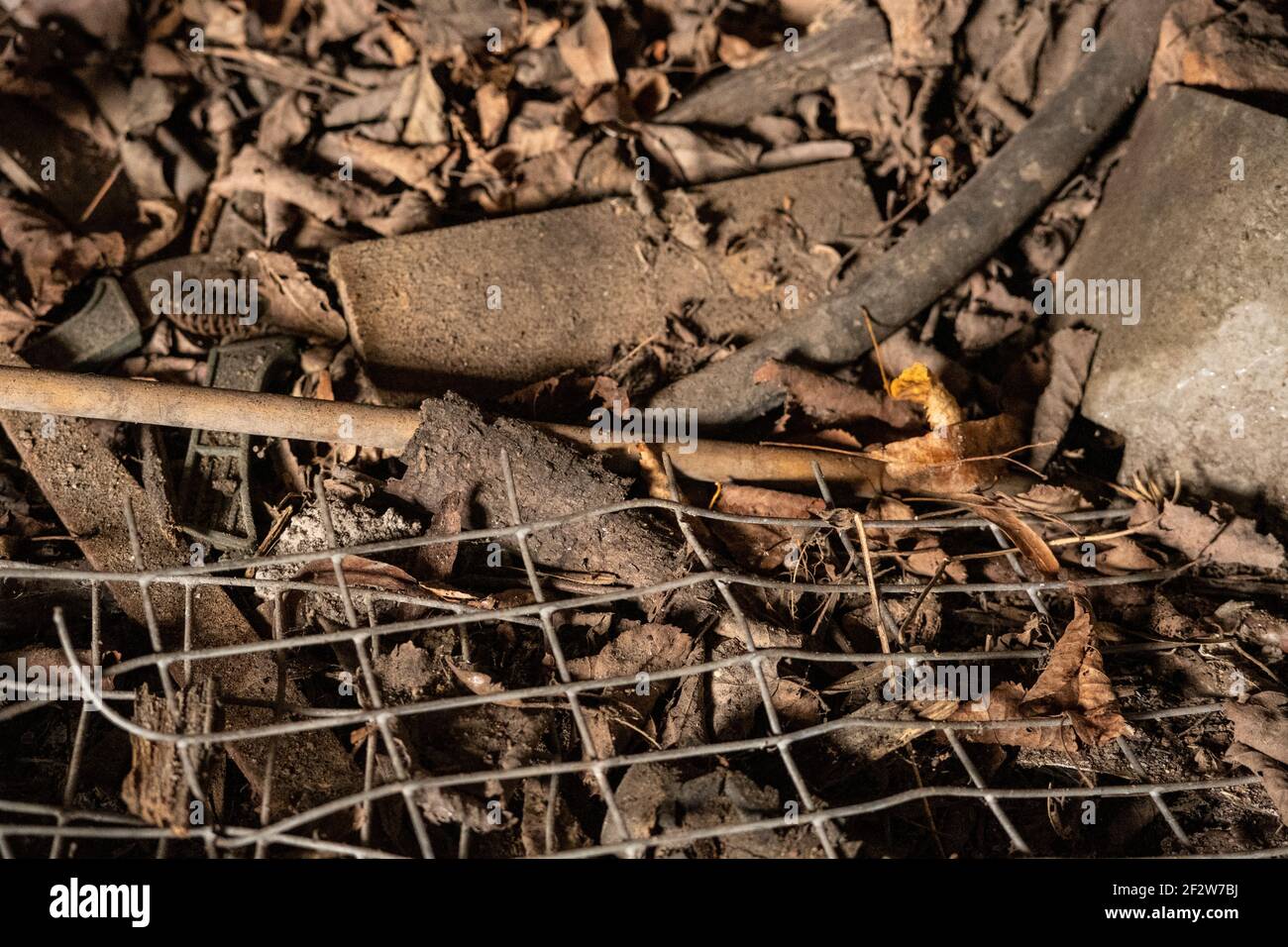 scrap metal parts and old rusty tools in abandoned workshop ancient ...