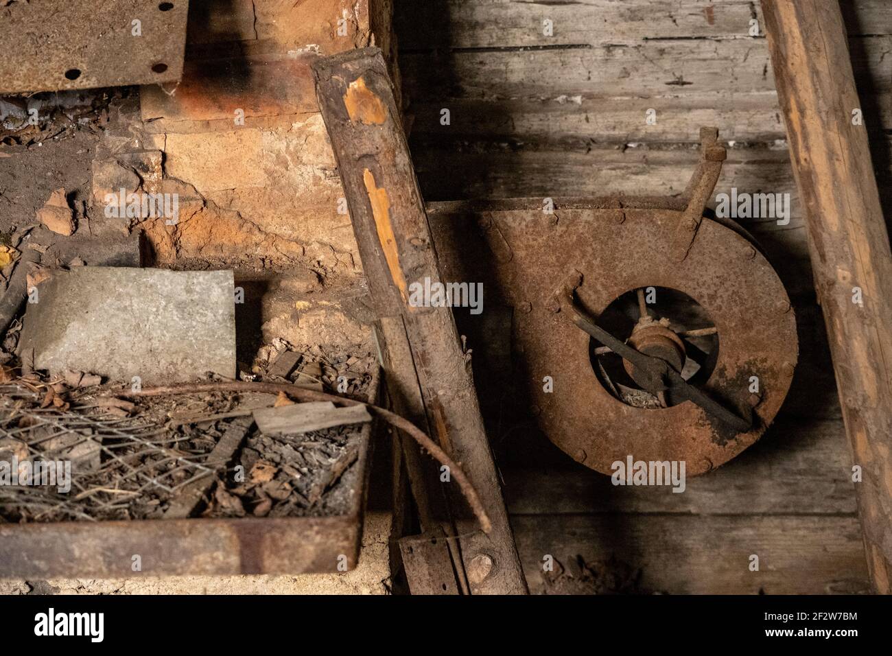 scrap metal parts and old rusty tools in abandoned workshop ancient ...