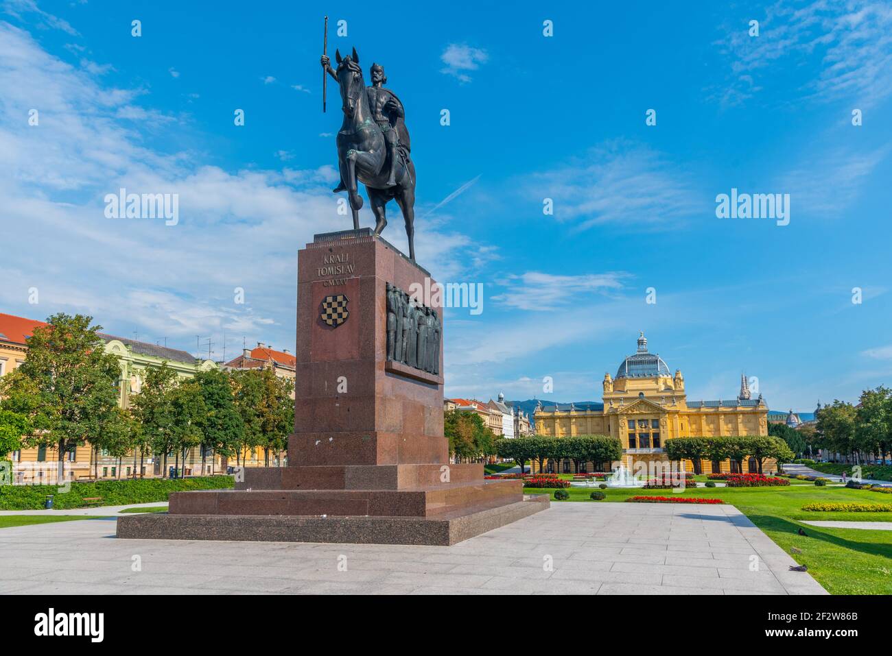 Statue of King Tomislav and yellow art pavilion in Zagreb, Croatia ...