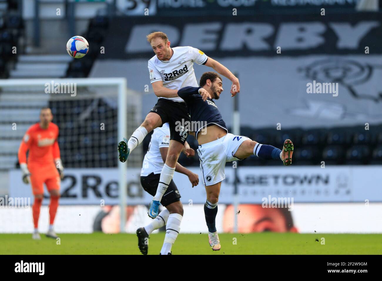 Derby, UK. 13th Mar, 2021. Matthew Clarke #16 of Derby County beats ...