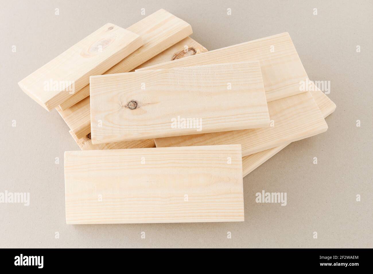 Stack of small planks on grey background. Hobby time Stock Photo - Alamy