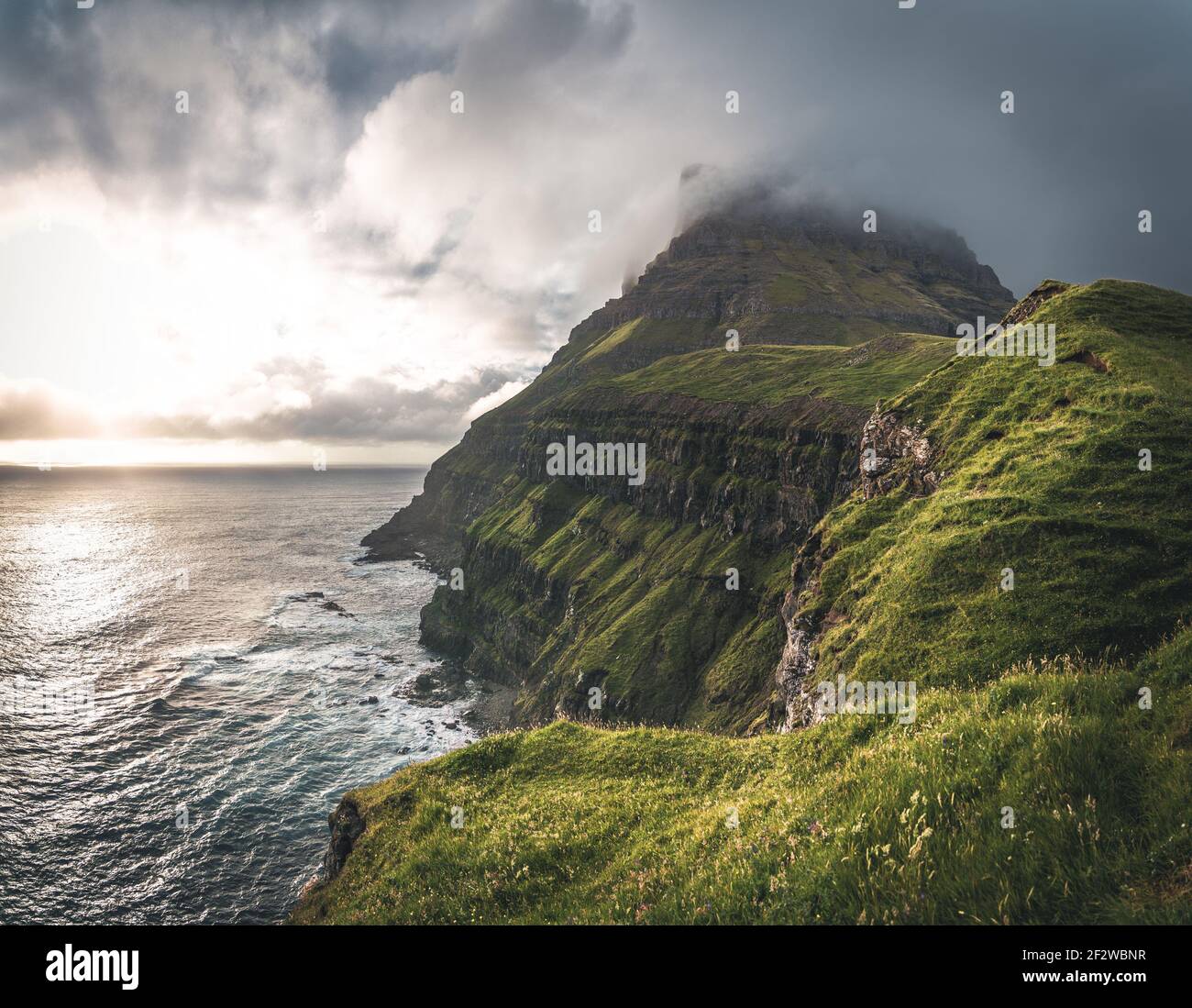 Faroe islands with stormy view towards mykines and atlantic ocean on ...