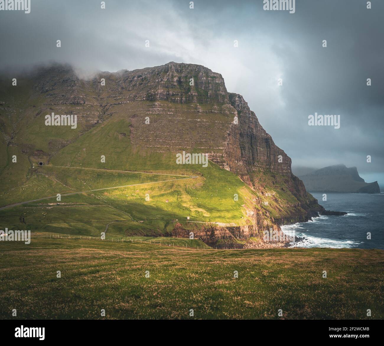 Faroe islands with stormy view towards mykines and atlantic ocean on ...
