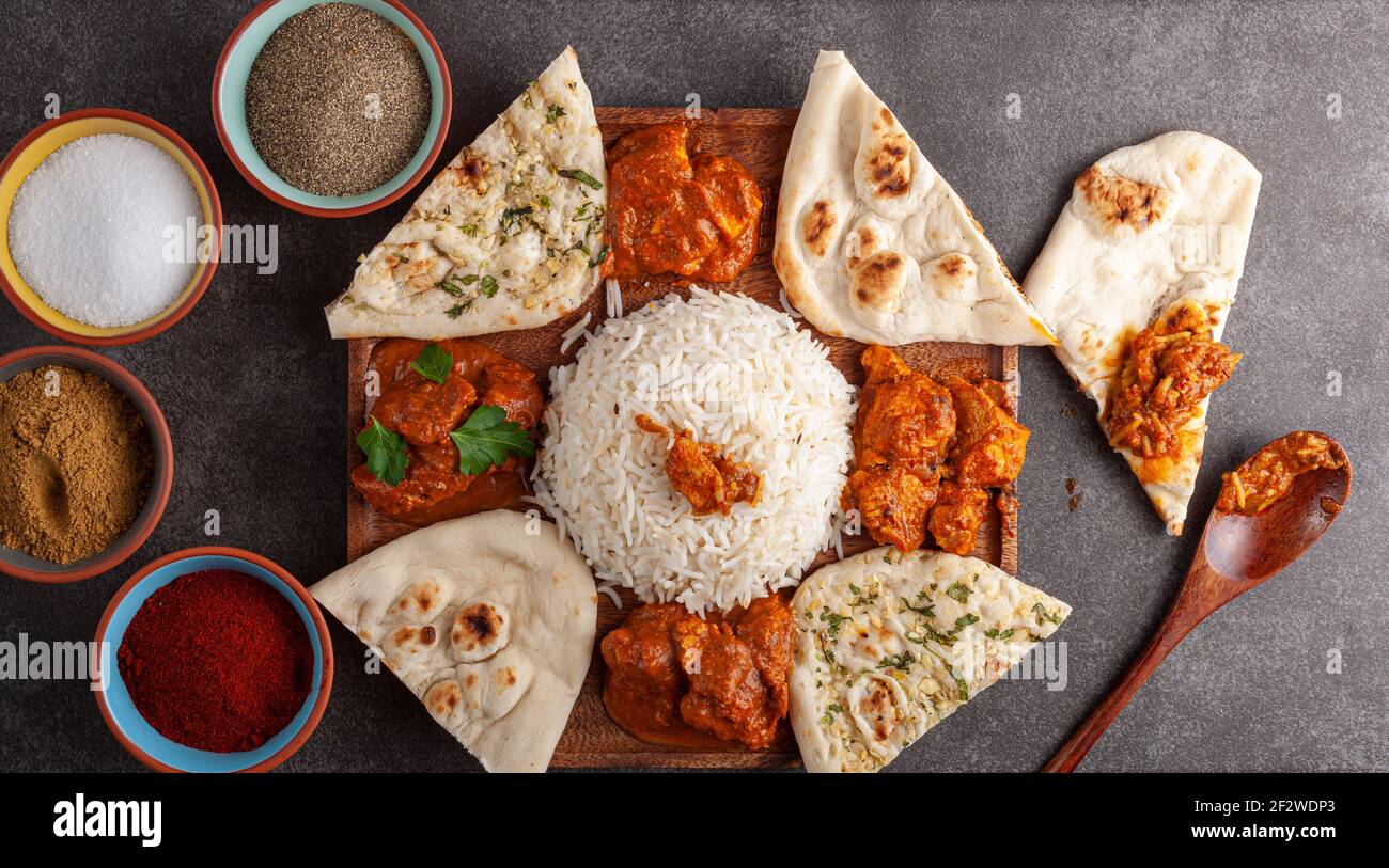 Flat lay image of a platter of traditional Indian food . Curried ...