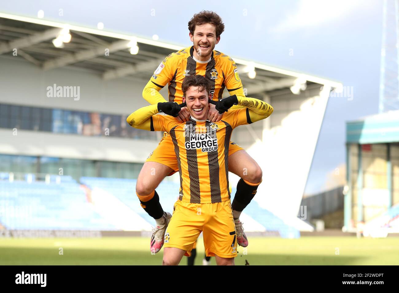 Cambridge United's Luke Hannant (bottom) celebrates scoring their side ...
