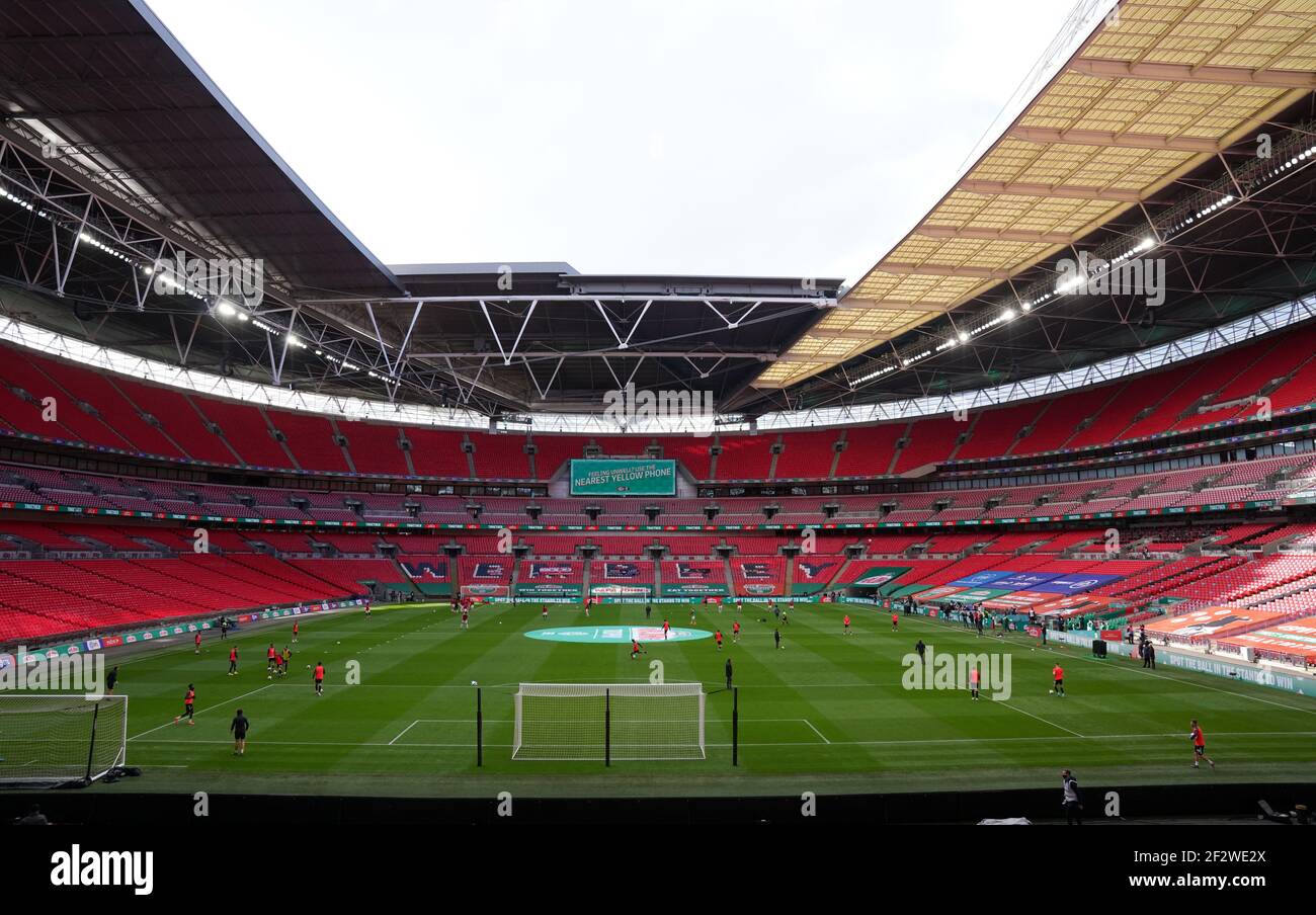 Portsmouth and Salford City players warm up in an empty Wembley Stadium ...