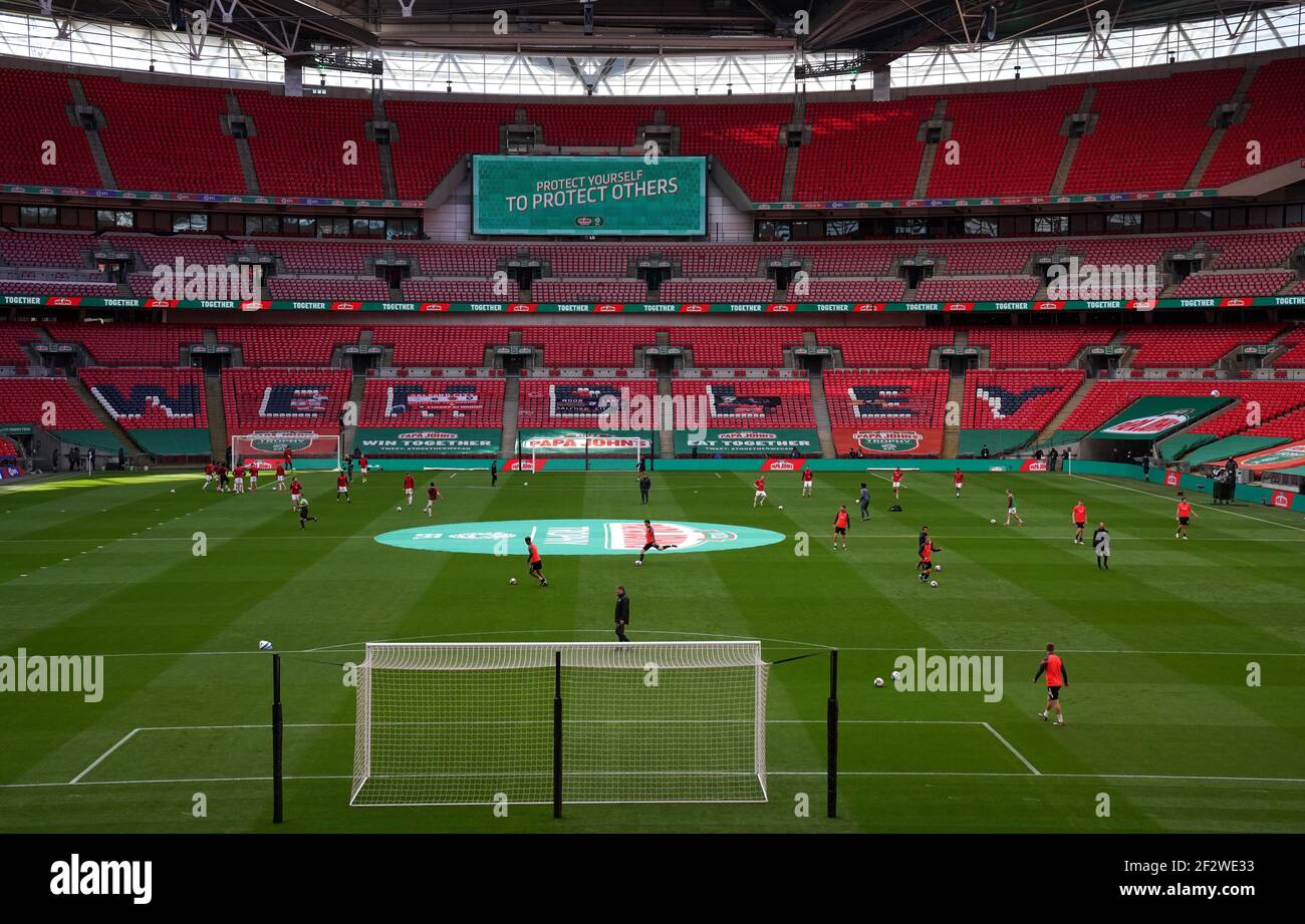 Portsmouth and Salford City players warm up in an empty Wembley Stadium ...