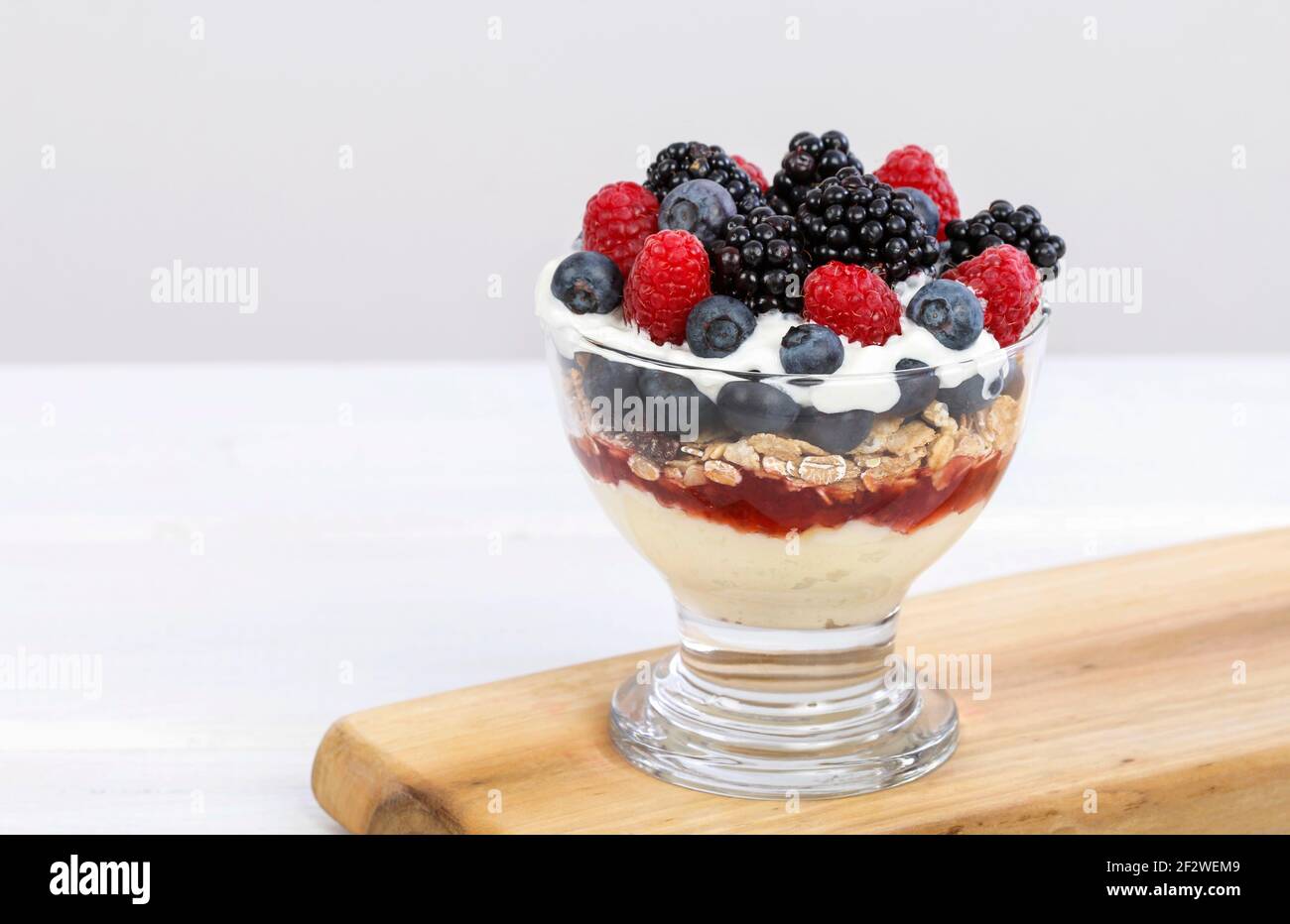 Layer fruit dessert in glass container. Party dessert Stock Photo - Alamy