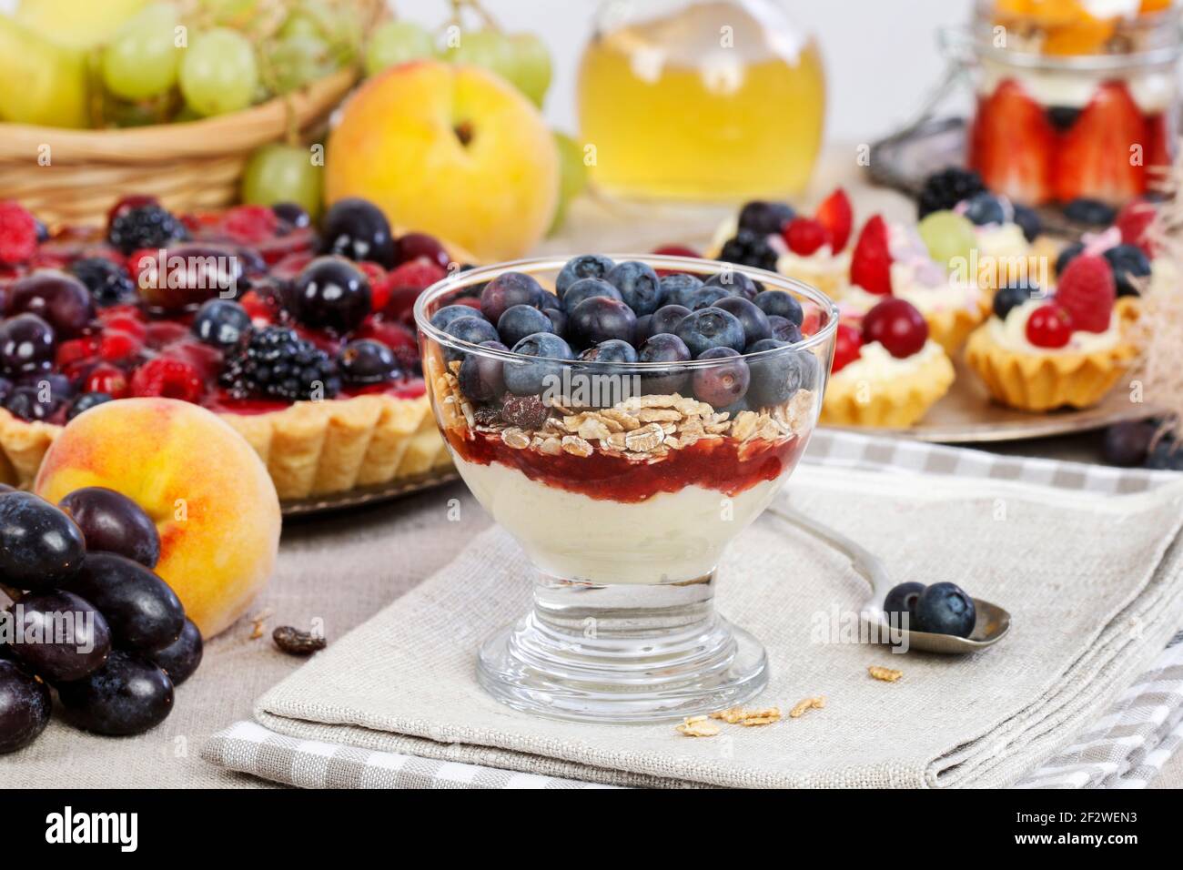 Layer fruit dessert in glass container. Party dessert Stock Photo - Alamy