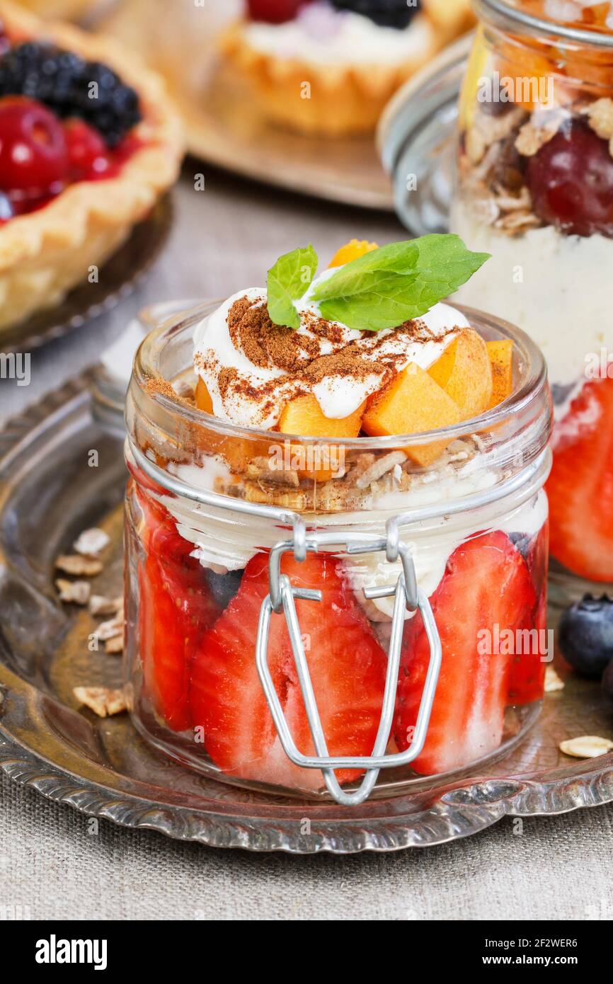 Layer fruit dessert in glass container. Party dessert Stock Photo - Alamy