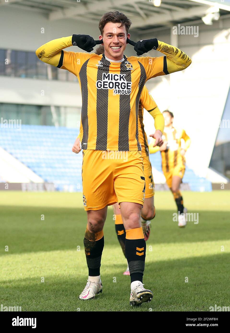 Cambridge United's Luke Hannant celebrates scoring their side's fourth ...