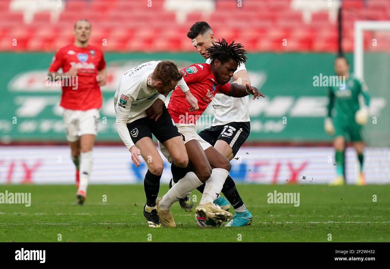 Portsmouth's Tom Naylor (left) and James Bolton (right) battle for the ...