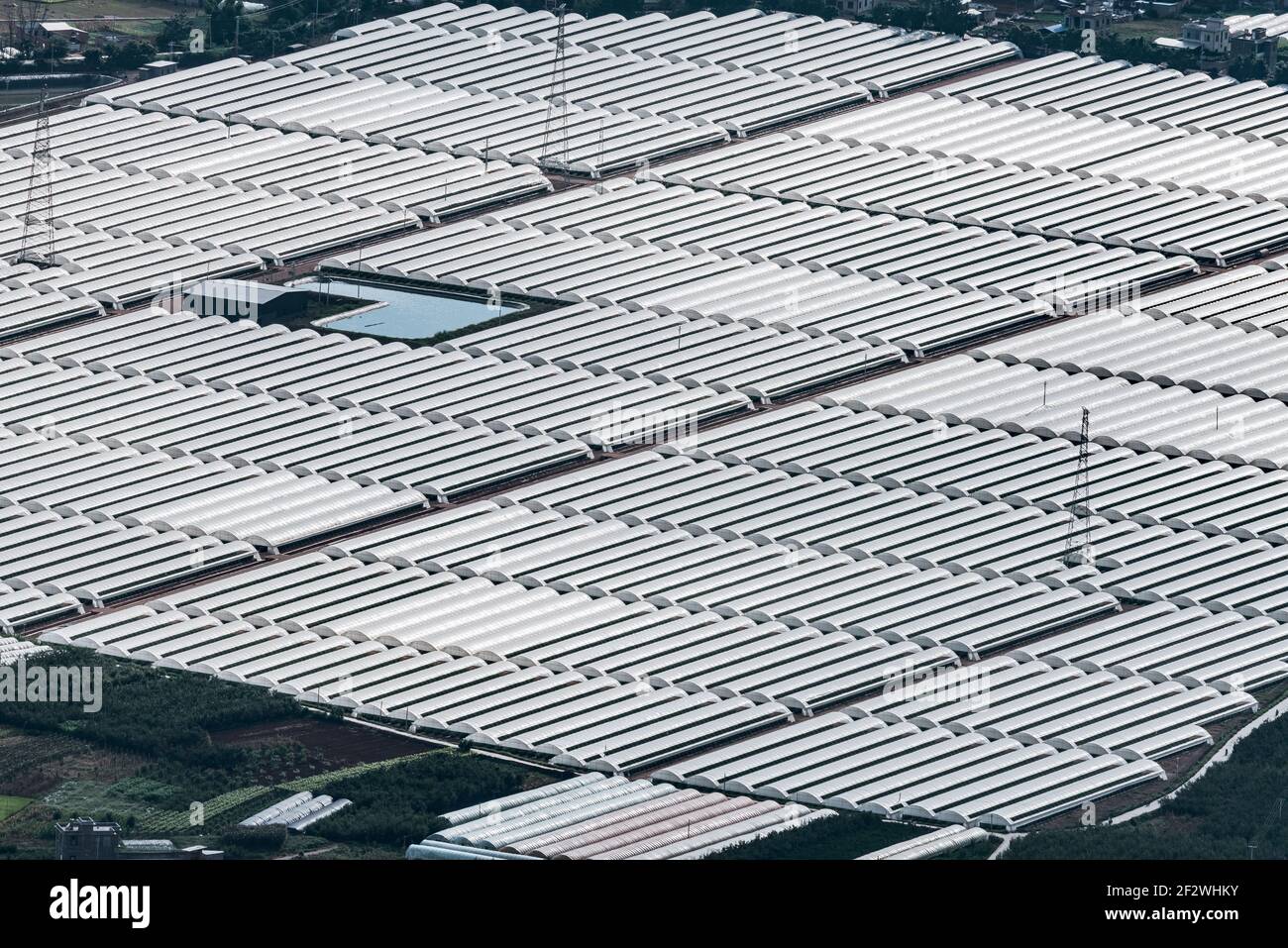 aerial view of agricultural plots of land under cultivation in an ...