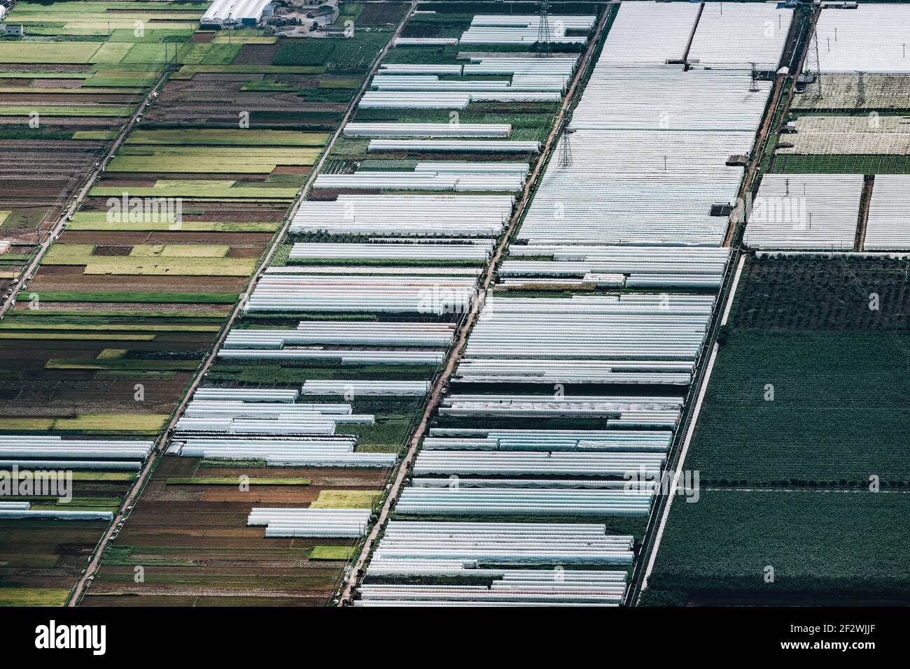 aerial view of agricultural plots of land under cultivation in an ...