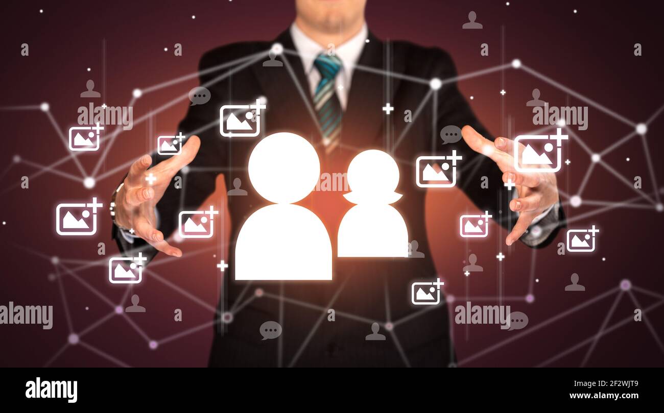 Hand holding social media icons Stock Photo - Alamy