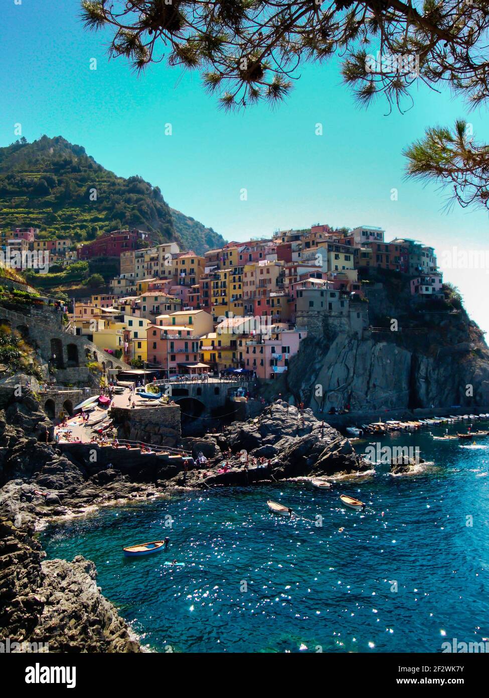 View of the town of Manarola in the Cinque Terre on a beautiful late ...